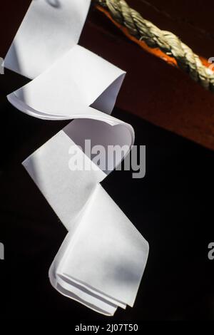 Zig zag, shide paper hanging from a rope across the entrance to a ...