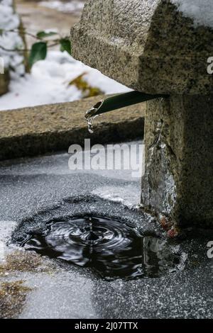The dripping water basin in the Japanese Garden at Kew Gardens in ...
