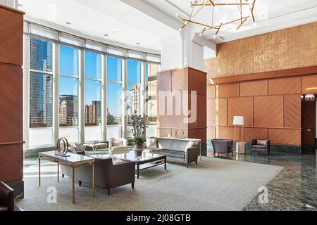 A high rise condominium lobby in downtown Chicago with cozy furniture ...