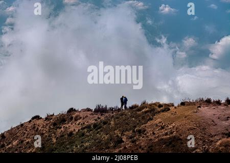 Hikers in the clouds on Santa Maria volcano, Quetzaltenango, Guatemala ...