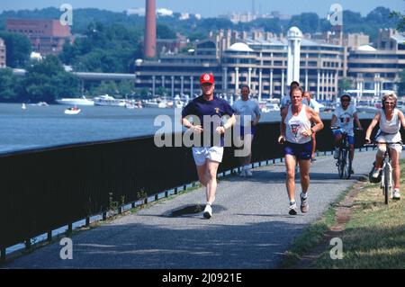US President Bill Clinton goes jogging July 4, 1993 in Washington DC ...