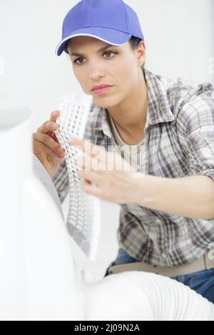 Apprentice electrician using meter Stock Photo - Alamy