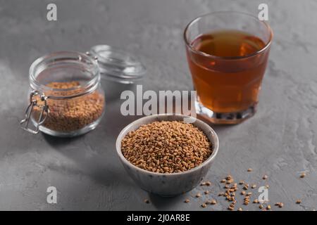 Glass of Egyptian fenugreek yellow tea, Helba or Methi Dana drink and ...