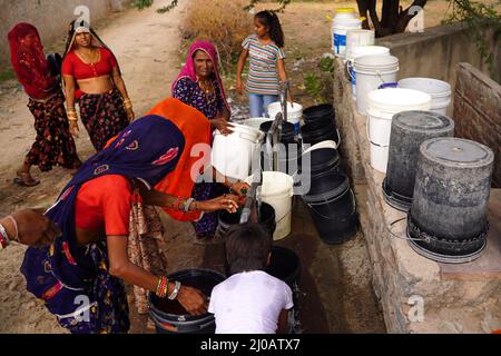 Indian Villagers Collects Drinking water from a road side water tap on ...