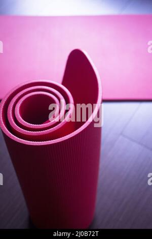 Red fitness, yoga and pilates foam mats in sports aerobics gymnasium ...