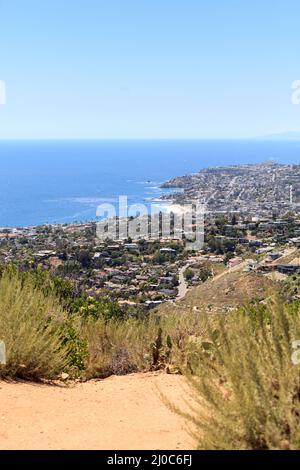 High hillside view of coastline of Laguna Beach with the ocean in ...