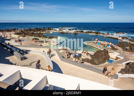 Natural pools with black volcanic rock in the Atlantic Ocean Porto Moniz, Madeira, Portugal ...