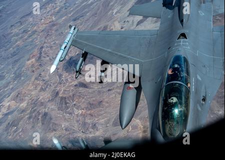Brig. Gen. Michael Drowley, 57th Wing commander, waves from the ...