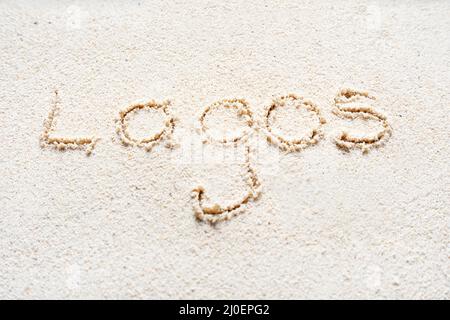 Handwriting words "Lagos" on sand of beach Stock Photo - Alamy
