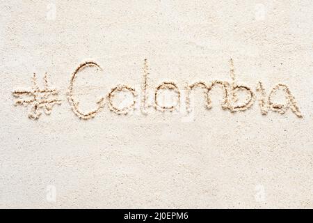 Handwriting words "Colombia" on sand of beach Stock Photo - Alamy