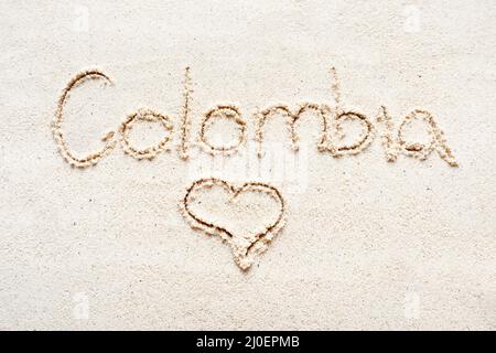 Handwriting words "Colombia" on sand of beach Stock Photo - Alamy