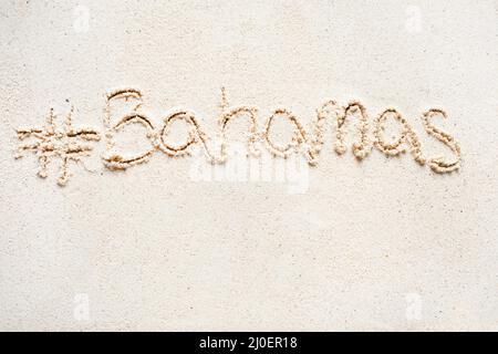 Handwriting words "Bahamas" on sand of beach Stock Photo - Alamy