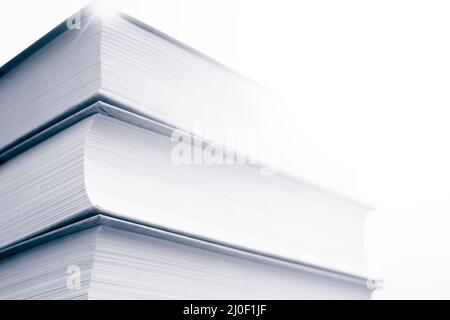 Thick paper books are a symbol of education and wisdom. A stack of ...