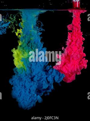 Patterns in the water with colorful mixed paints Stock Photo - Alamy