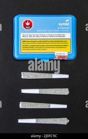 Four Joints of Legal Canadian Cannabis on a black leather background. 2 ...