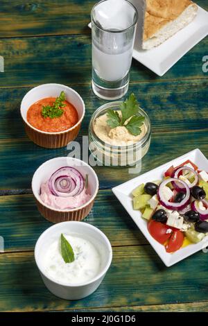 greek starter on green wood Stock Photo - Alamy