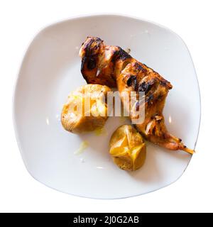 Baked in oven quarter of rabbit, served with pototoes at plate Stock ...