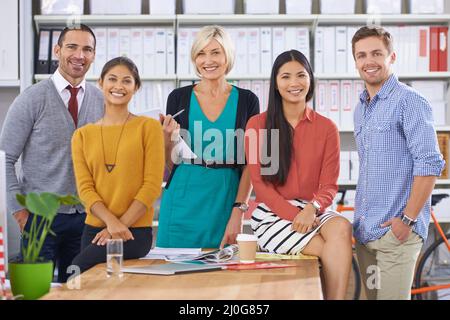 Theyre the number one business team. three young colleagues in their ...