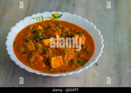 Famous Indian dish "matar paneer" is ready to serve Stock Photo - Alamy