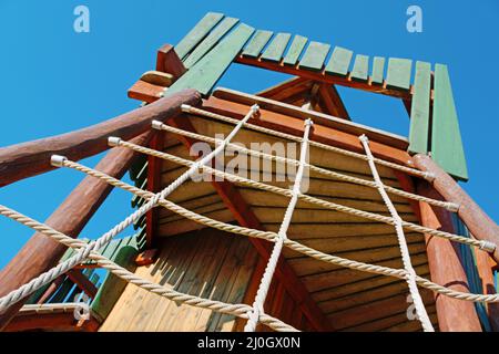 Children's playground with wooden climbing tower Stock Photo - Alamy