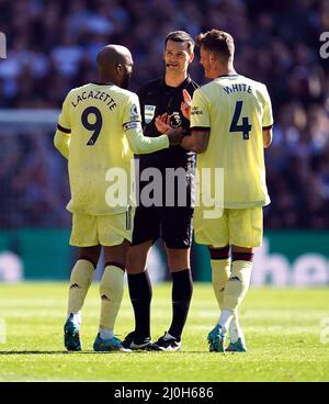 Referee Andrew Madley speaks to Arsenal's Jorginho during the Premier ...