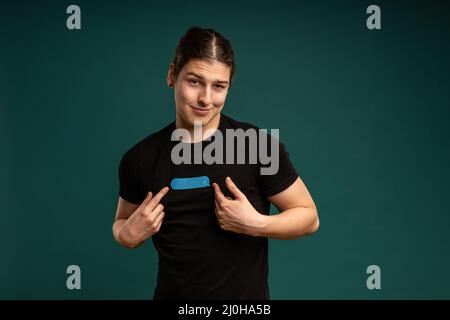 proud expression of a young man. Cropped studio portrait of male mood ...