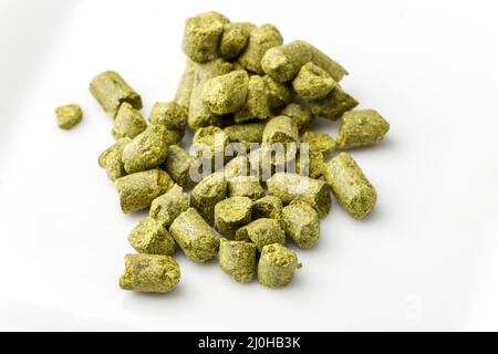 Hop pellets for brewing on a white background Stock Photo - Alamy