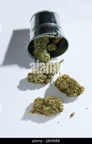 Dry cannabis, marijuana in a bucket isolated on white background ...
