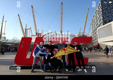 Fans pose by UFC signage outside The O2, London before the UFC Fight ...