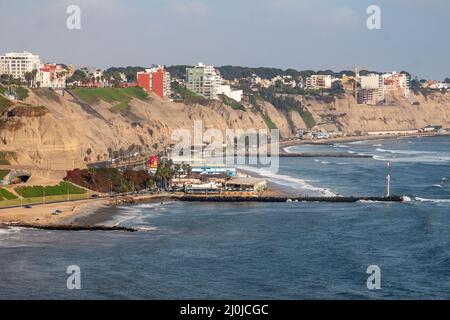 Aerial view of cliffs alongside the Miraflores beach in Lima, Peru ...