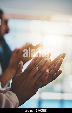 He deserves a round of applause. Shot of a group of cheerful young ...