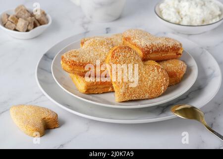 Heart-shaped cottage cheese biscuits for breakfast Stock Photo - Alamy