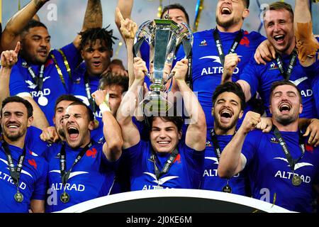 France's Antoine Dupont lifts the Guinness Men's Six Nations Championship trophy after winning ...