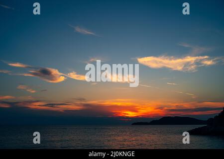 Fiery red sunset sky over the sea Stock Photo - Alamy