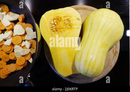 Peeled butternut squash, split down the middle Stock Photo - Alamy