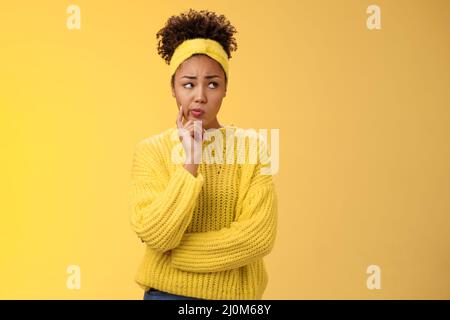 Perplexed unsure cute timid african-american female thinking how escape ...