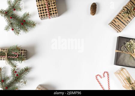 Gift boxes with green branches candy canes Stock Photo - Alamy