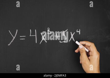 Hand writing math equation Stock Photo - Alamy