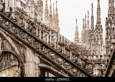 High spires with sculptures of the Duomo. Milan, Italy Stock Photo - Alamy