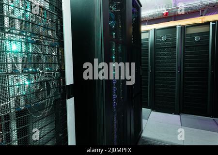 Data center with multiple rows of fully operational server racks Stock ...