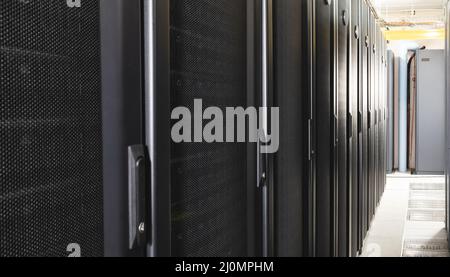 Data center with multiple rows of fully operational server racks Stock ...