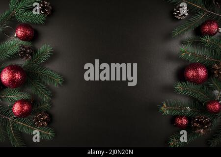 Christmas pattern with red baubles, evergreen branches and white balls ...