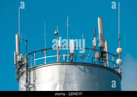 Top of Water tower with communication antennas. Old water tower with 4G ...