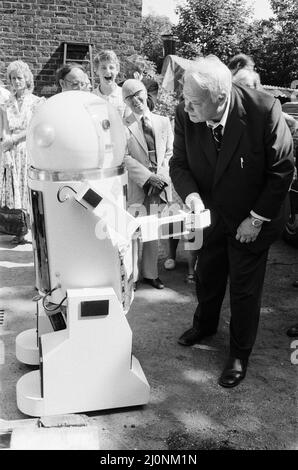 TV Astrologer Patrick Moore meets Denby the robot, which talks, shakes ...