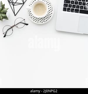 Top view of workspace with notebook, laptop and copy space on black ...