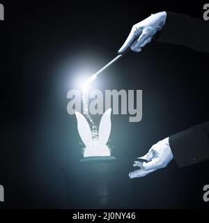 Magician is showing magic trick Stock Photo - Alamy