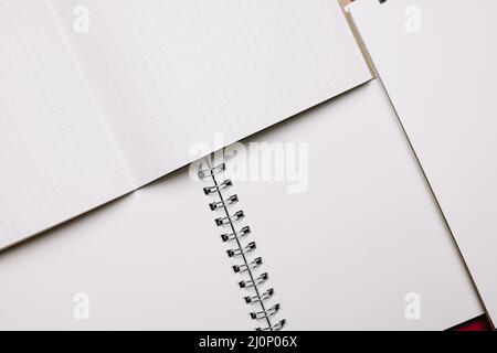 Beautiful background with opened blank spiral notepad and pen framed ...