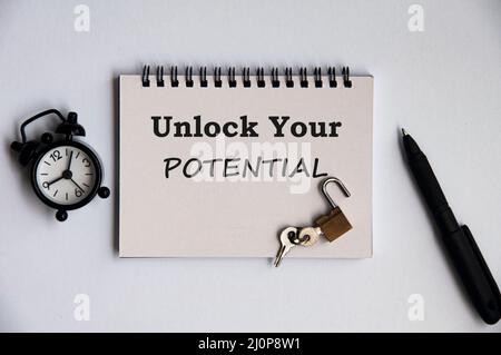 Motivational quote notepad - Unlock your potential text on yellow cover ...