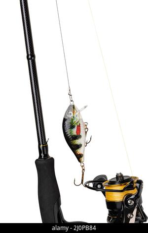 Spinning rod, reel and fishing baits isolated on wooden background, top ...