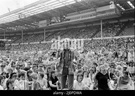 Fans at the "Summer of 84" concert at Wembley Stadium, which featured ...